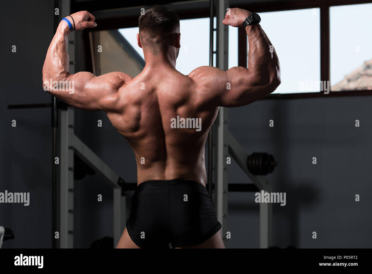 Portrait Of A Young Physically Fit Man Showing His Well Trained Body ...