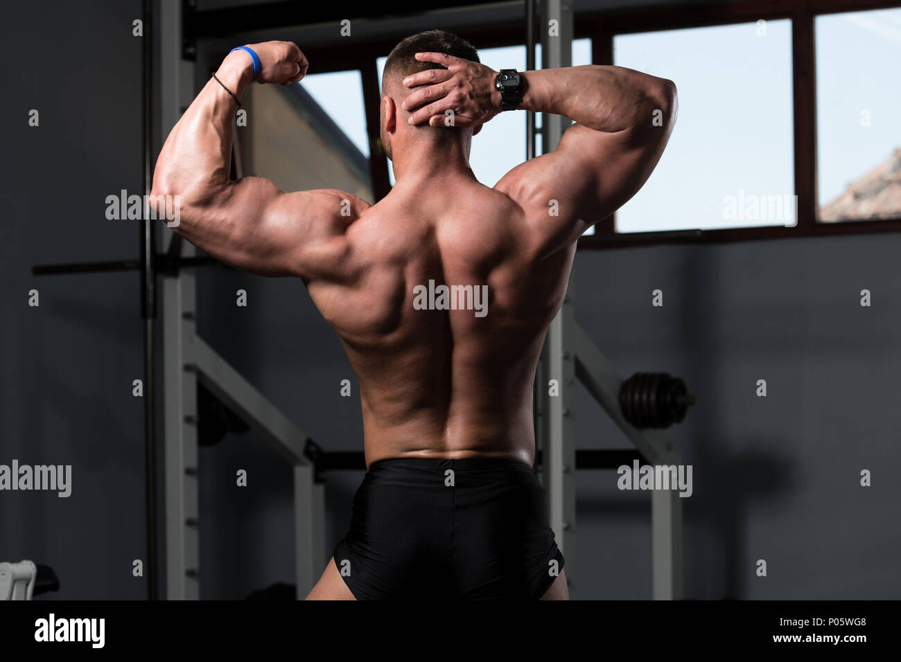 Portrait Of A Young Physically Fit Man Showing His Well Trained Body ...