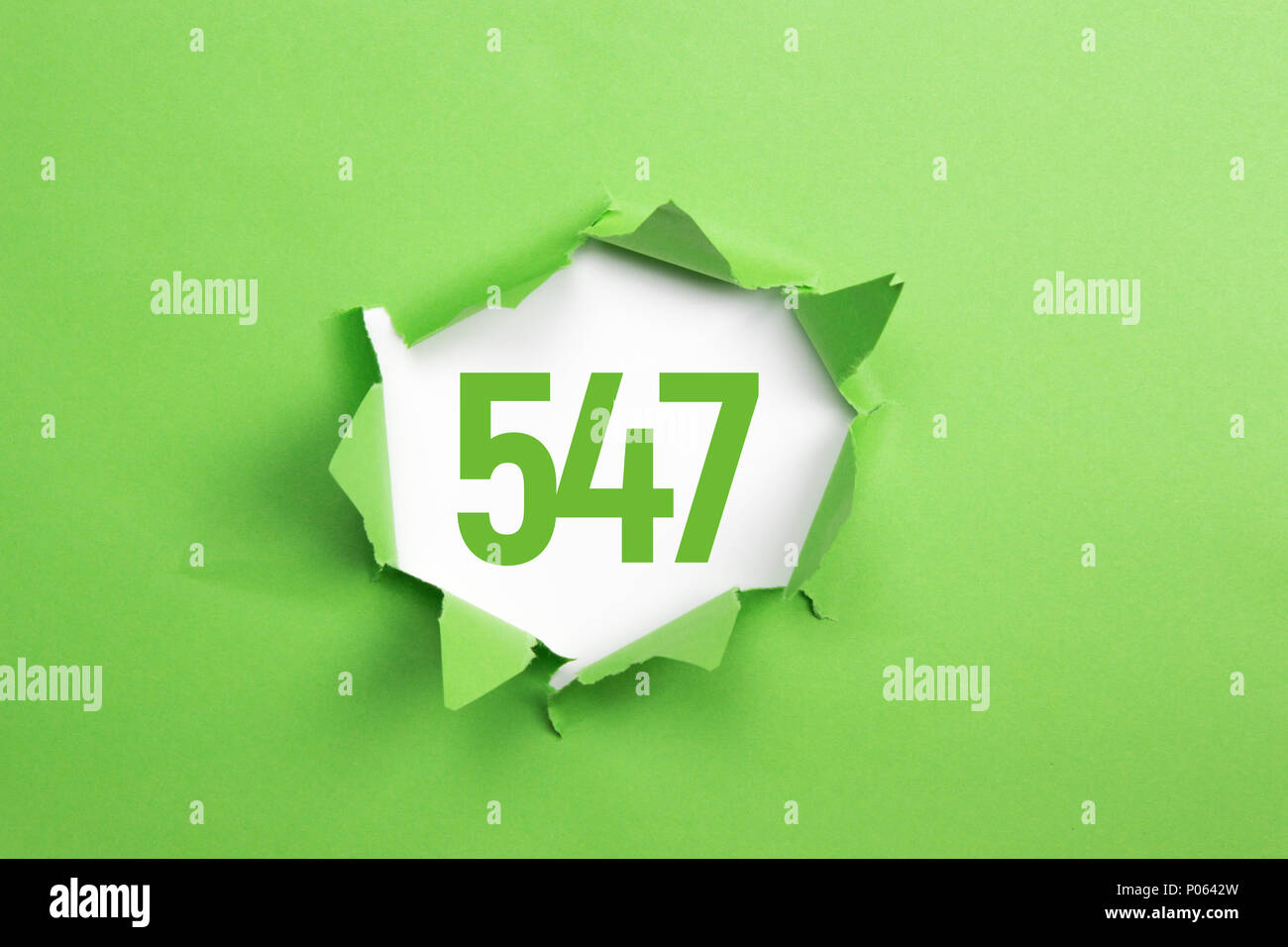 Green Number 547 on green paper background Stock Photo - Alamy