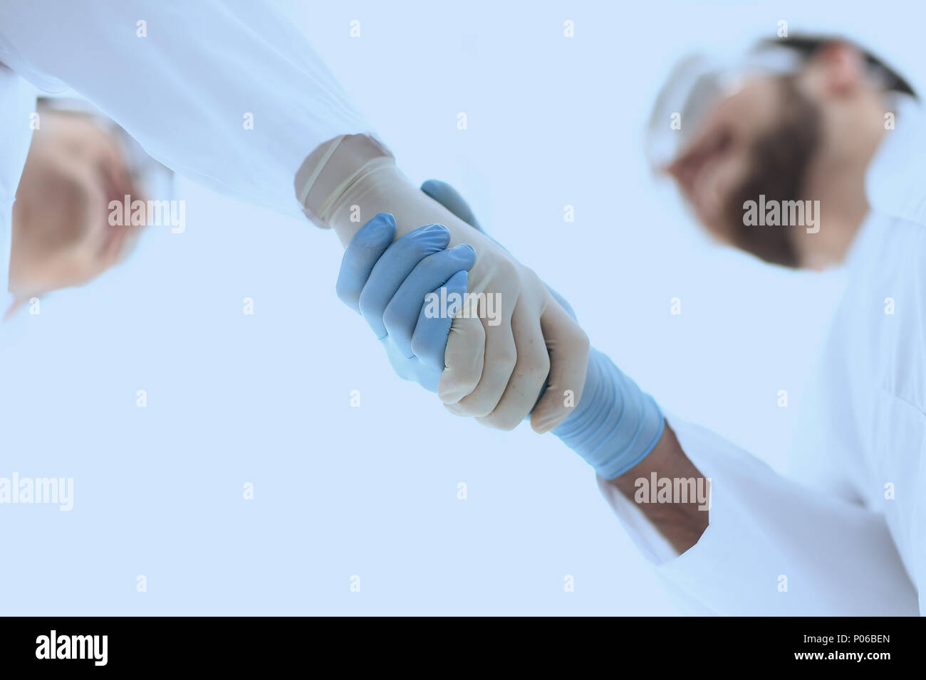closeup.two scientists shake hands.photo with copy space Stock Photo ...