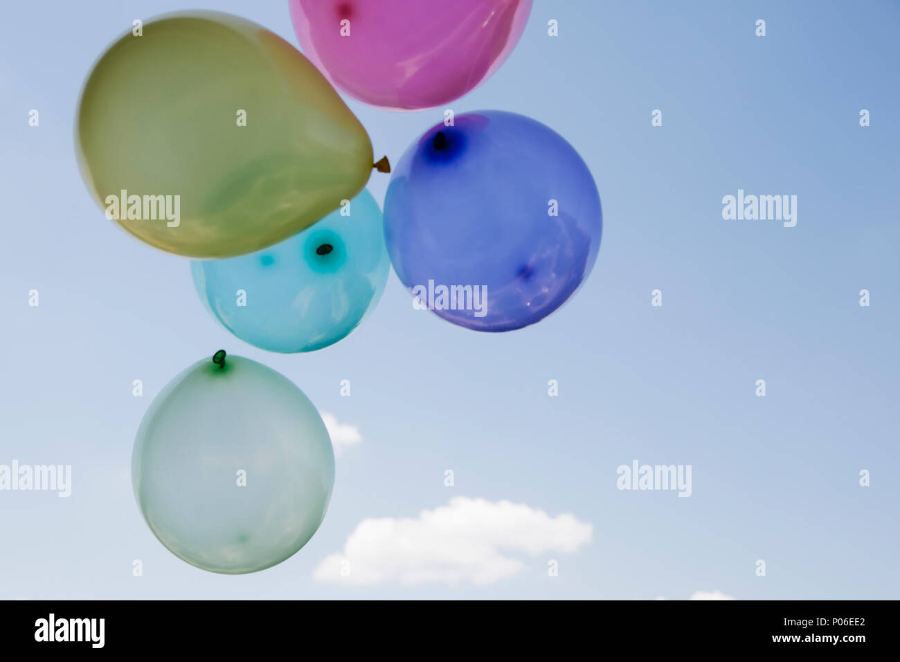 Colorful balloons fly in the sky hi-res stock photography and images ...