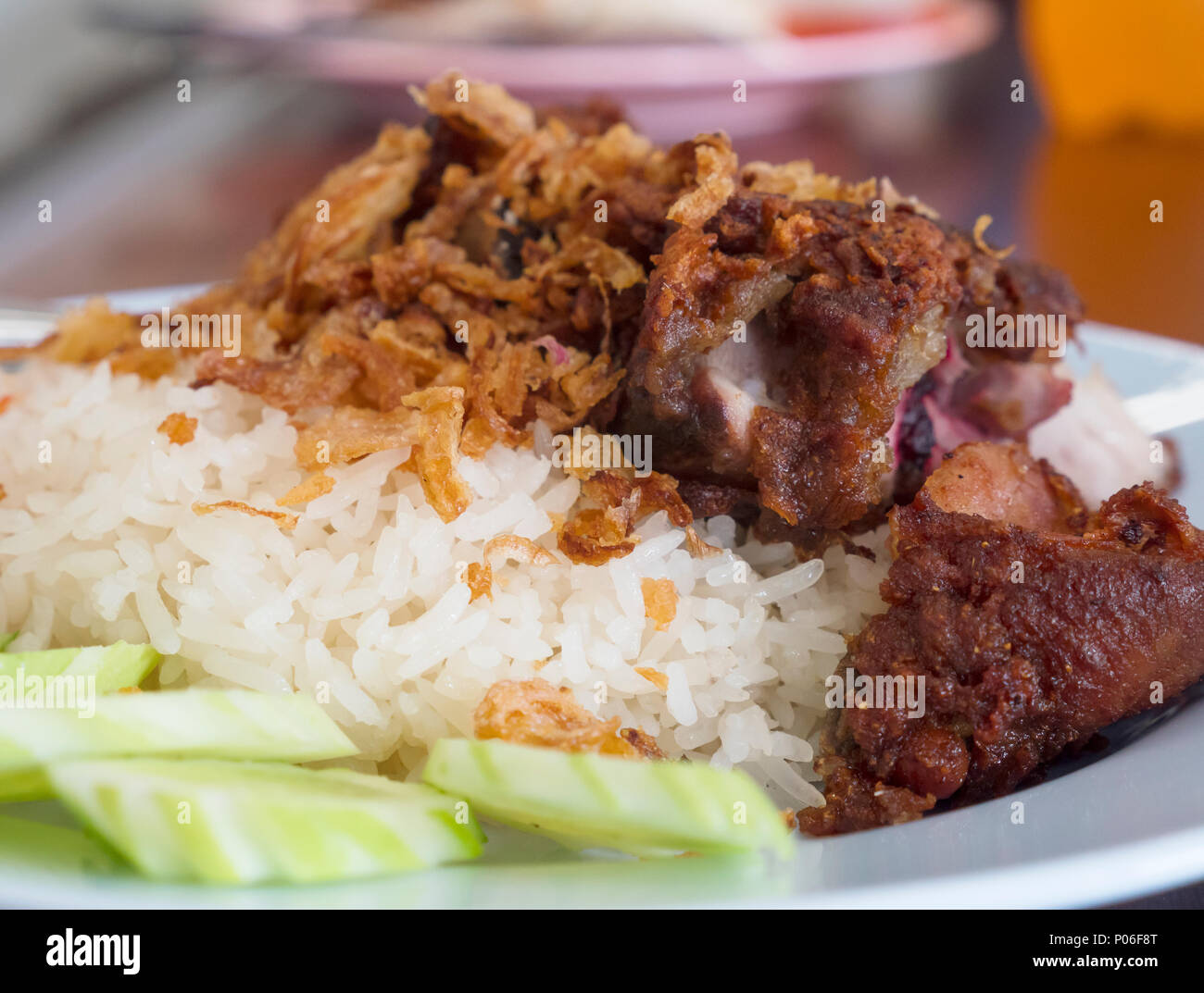 Crispy Thai style grilled chicken, gai yang, with crispy fried onion on ...