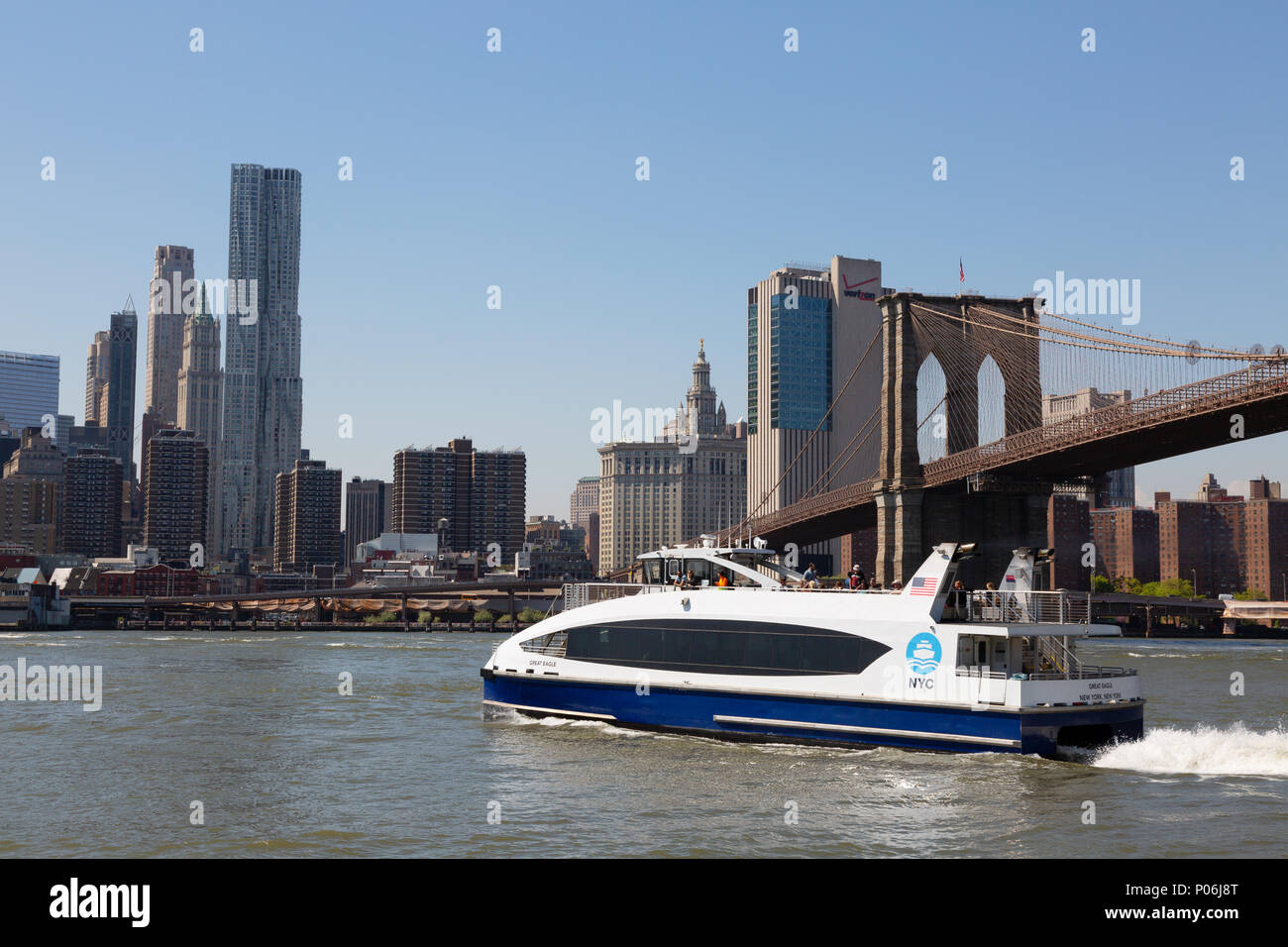 The East River Ferry crossing the East River at Brooklyn, New York city ...