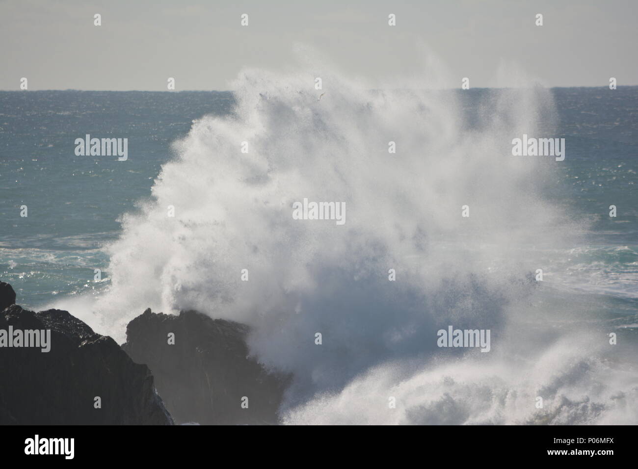 Explosion of wild surf at Sawtell, a wave crashing against the rocks ...