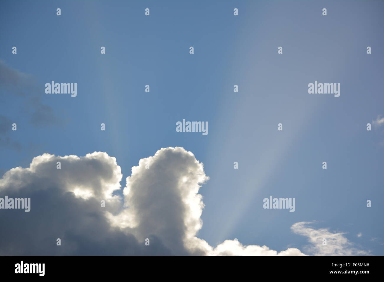 Sunlight shining sunbeams through the clouds. Rays of sunshine ...