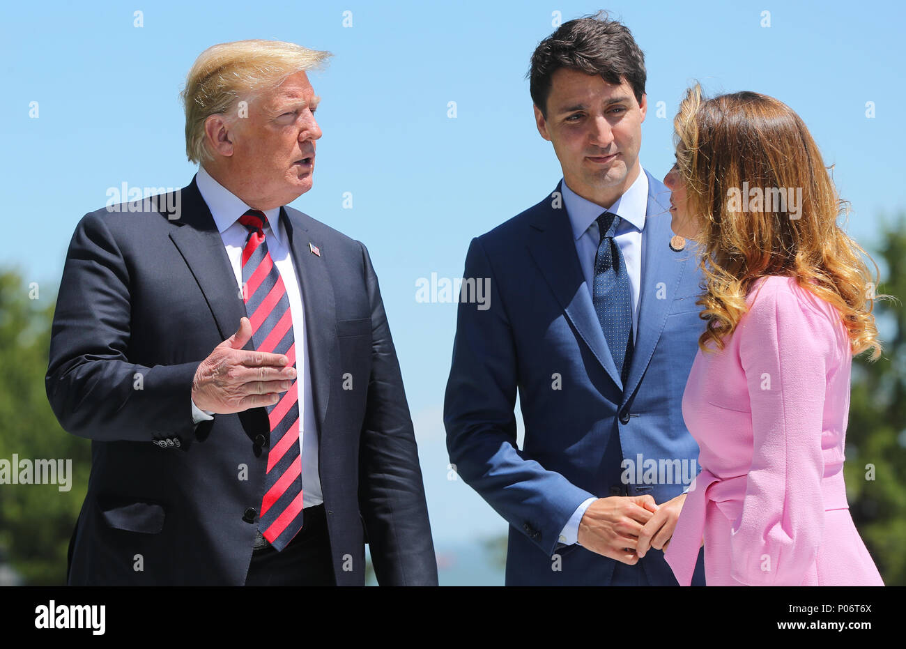 Quebec, Canada. 8th Jun, 2018. US President Donald Trump (l) is greeted ...