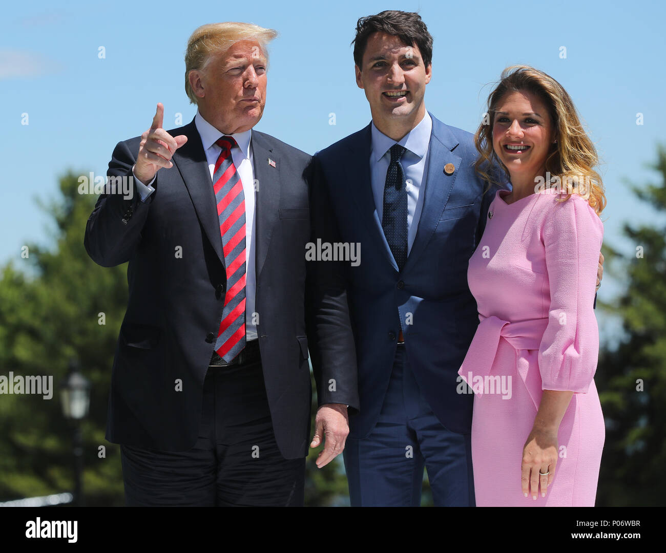 Quebec, Canada. 8th Jun, 2018. US President Donald Trump (l) is greeted ...