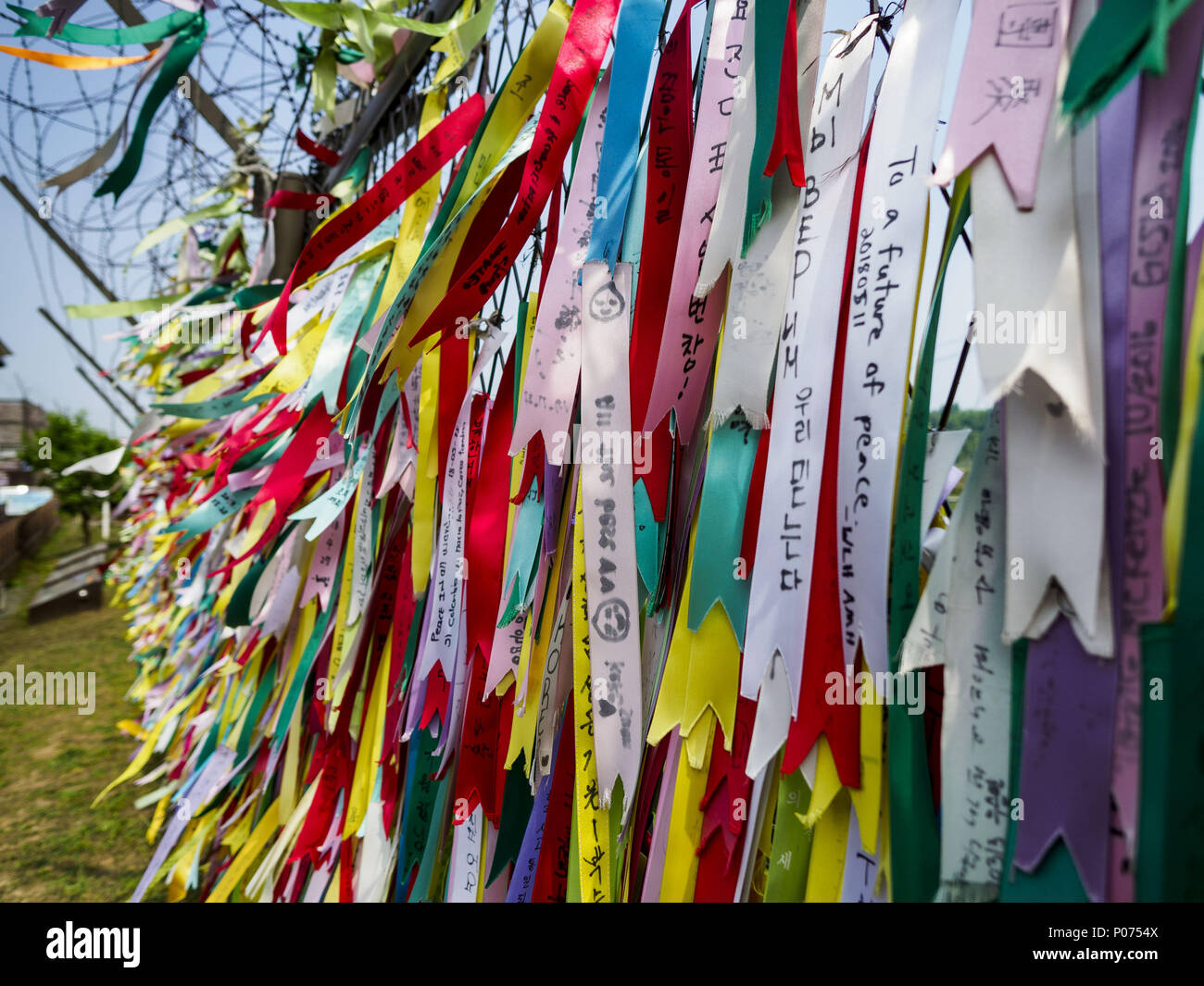 Paju, Kyonggi, South Korea. 9th June, 2018. Prayer flags hang on fence ...
