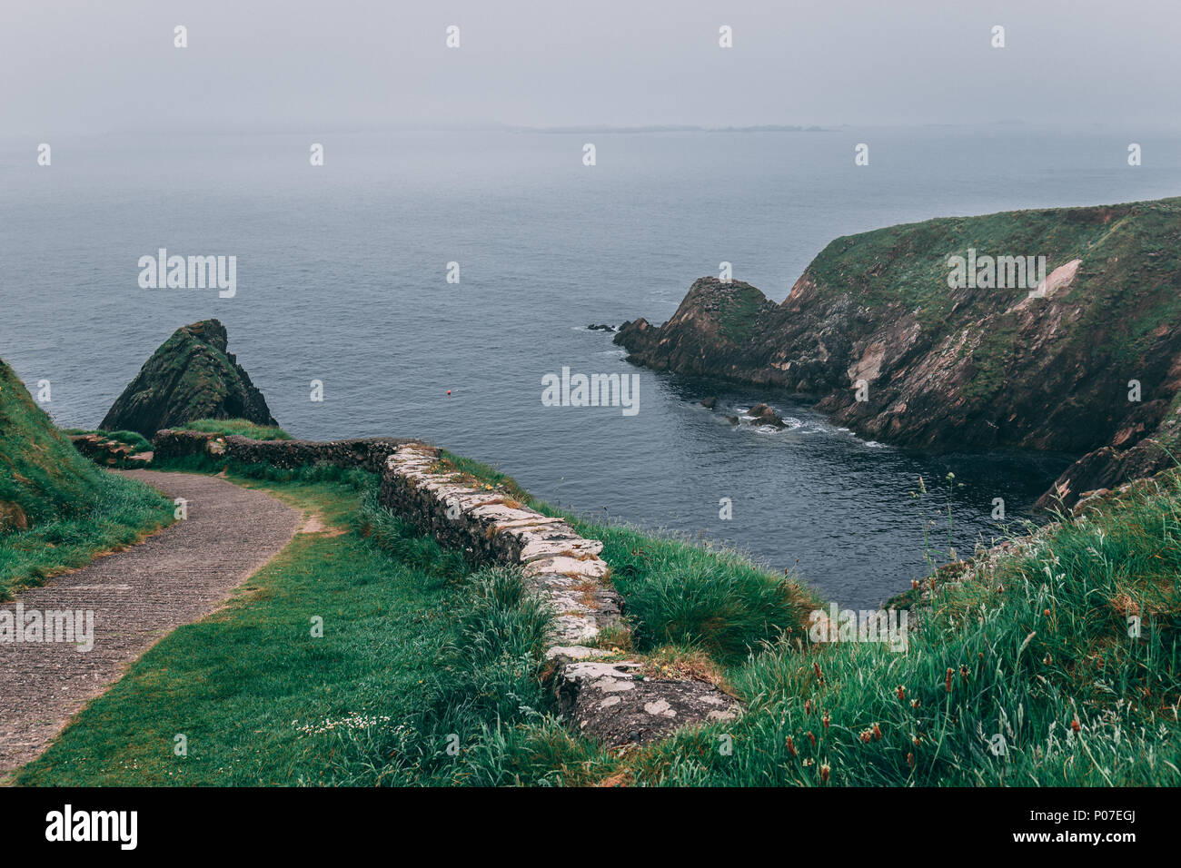 View from the iconic Dunquin harbour pier, the most westerly tip of the ...