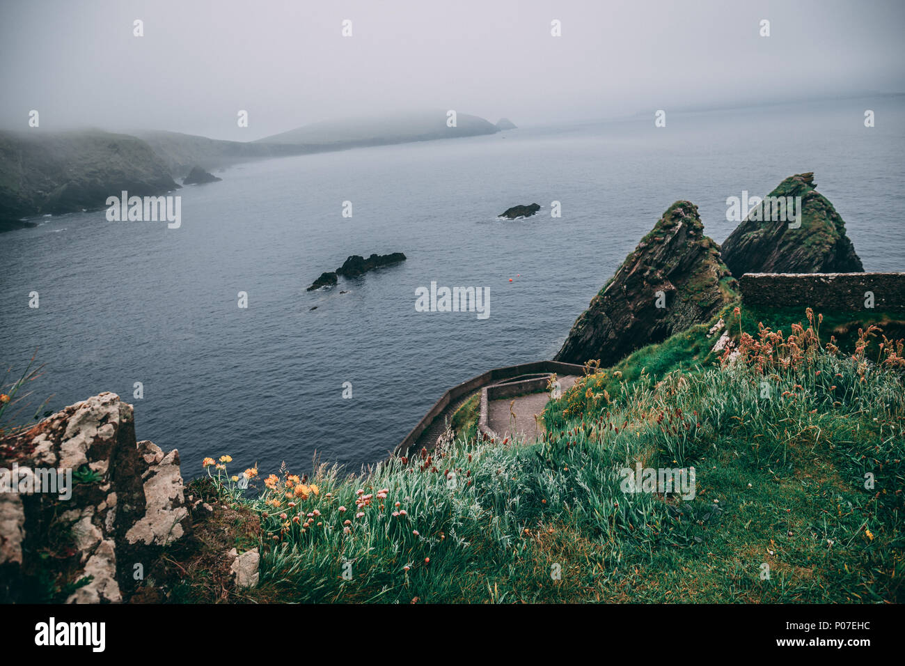 View from the iconic Dunquin harbour pier, the most westerly tip of the ...