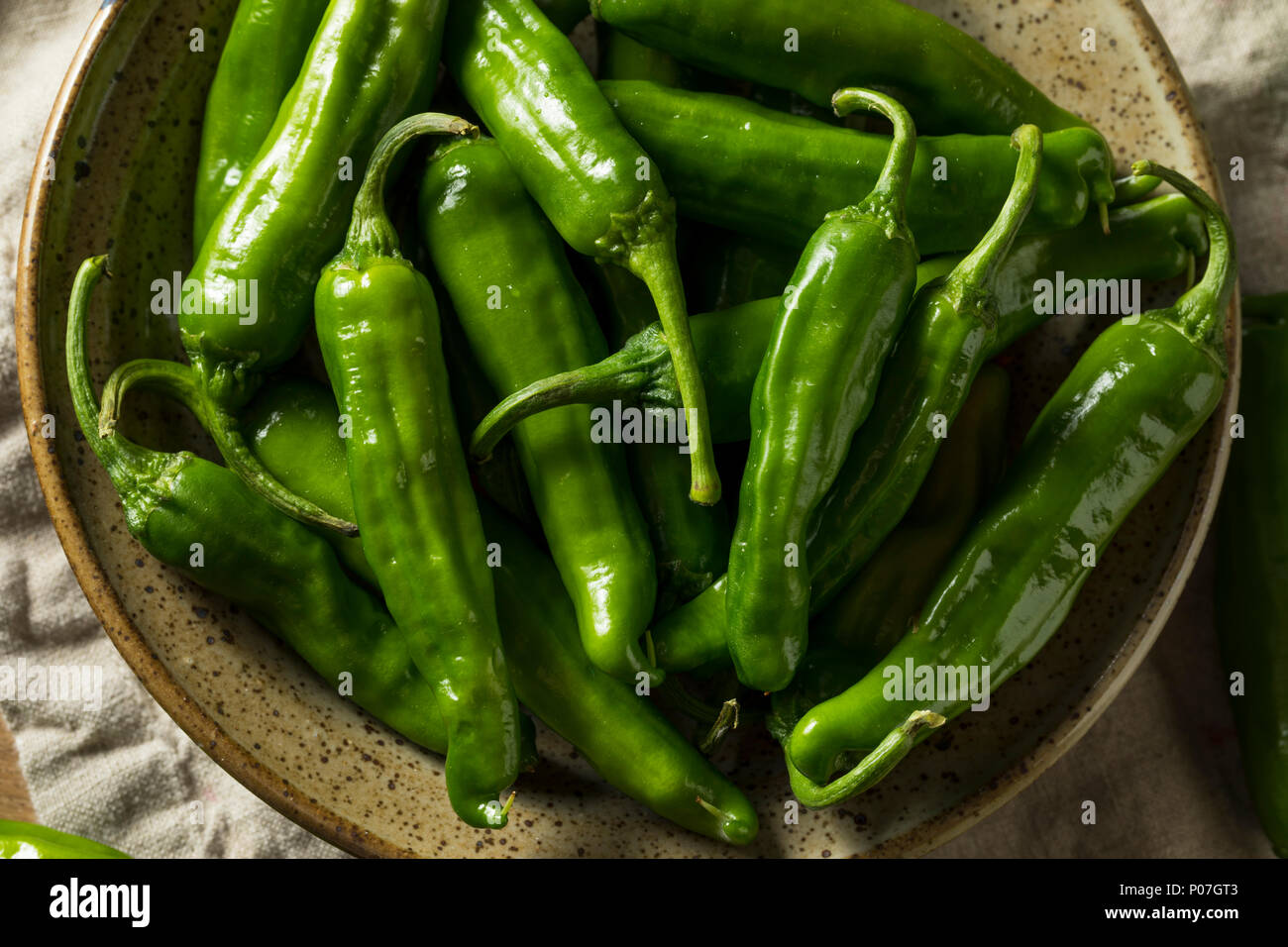 Raw Green Organic Shishito Peppers in a Bowl Stock Photo - Alamy