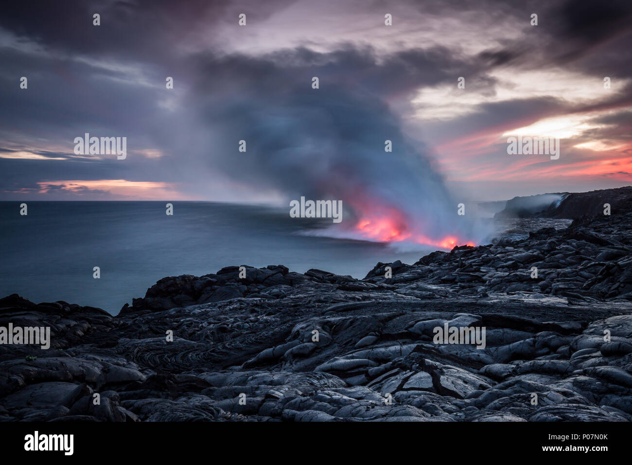 Hot molten lava flowing into the ocean on the Big Island of Hawaii ...