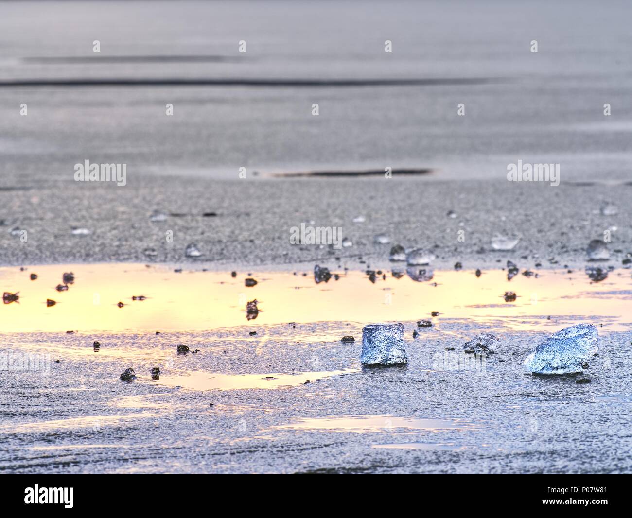 Broken floes and iceberg. A large ice piece on freshwater ice that has ...