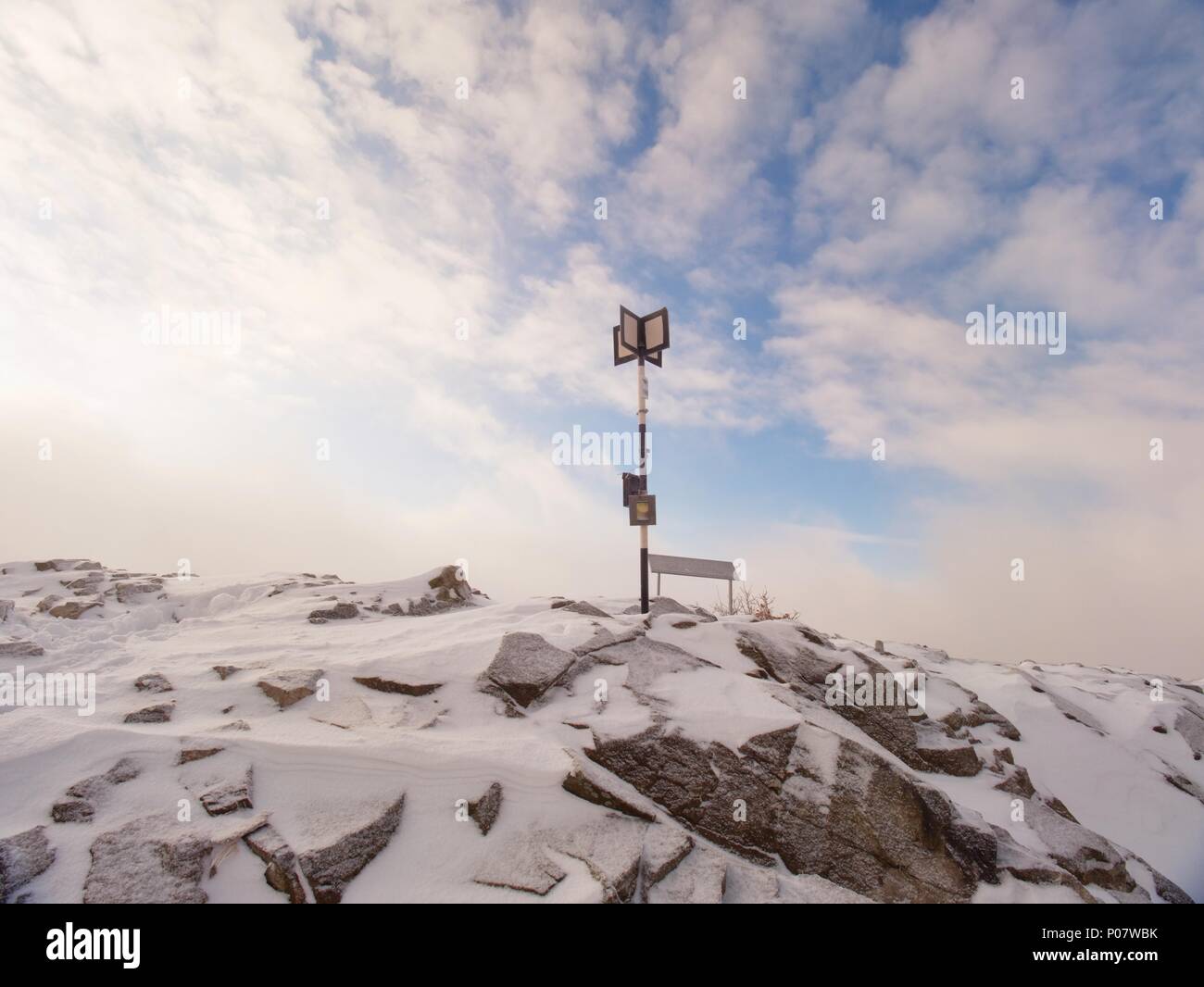 Slippery mountain tops in autumn covered with first snow and hidden in ...