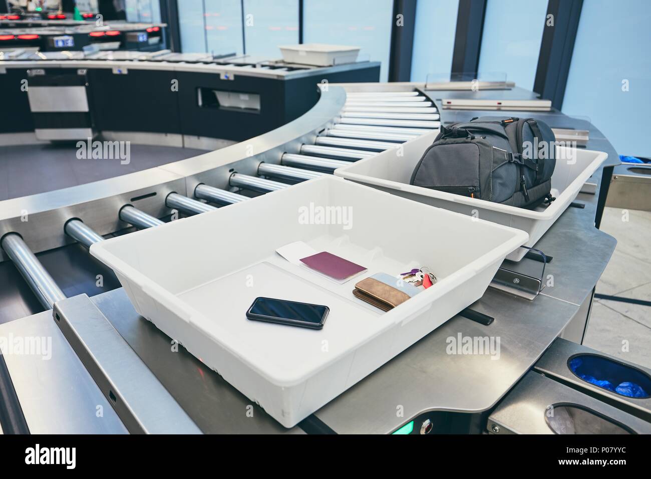 Airport security check. Containers with personal belongings (passport ...