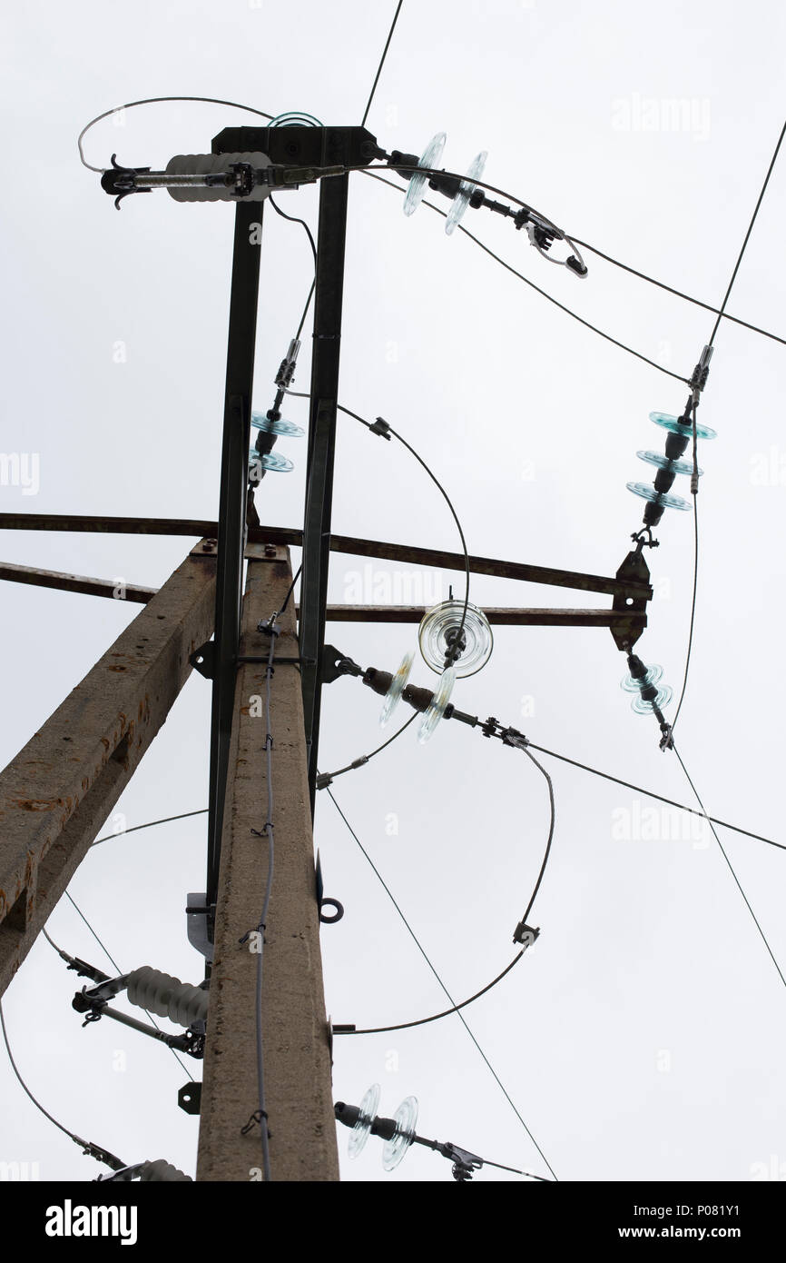 Below view of an old pylon with electric lines Stock Photo - Alamy