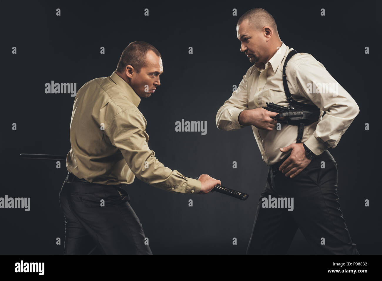 side view of men fighting with gun and katana sword on black Stock ...
