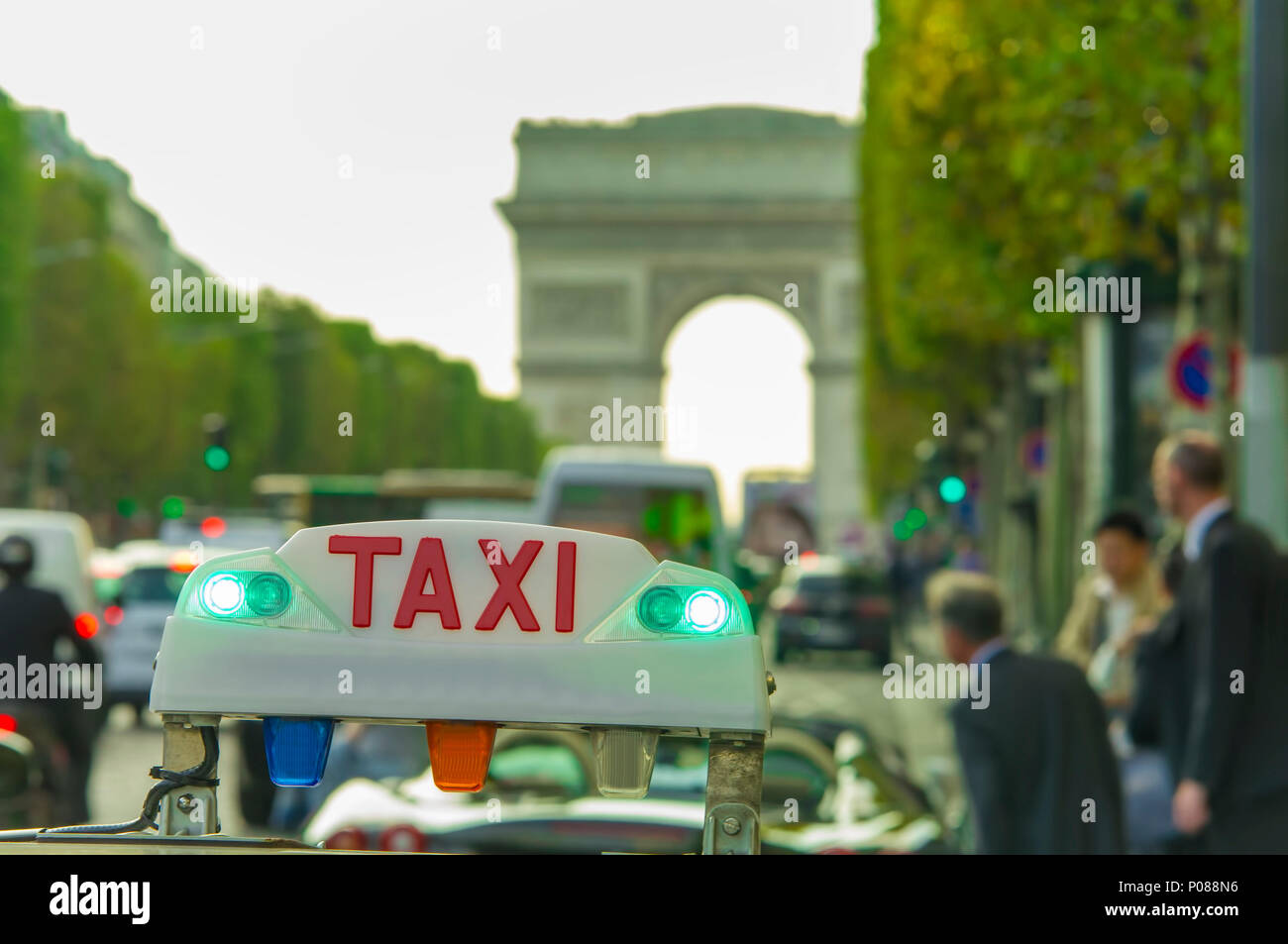 taxi car sign and business people. Arc de Triomphe in background, Paris ...