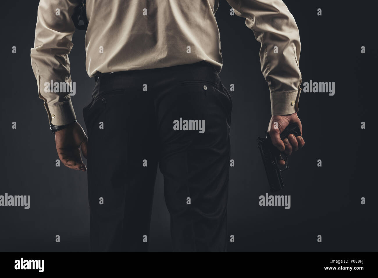 Man holding gun in hand hi-res stock photography and images - Alamy