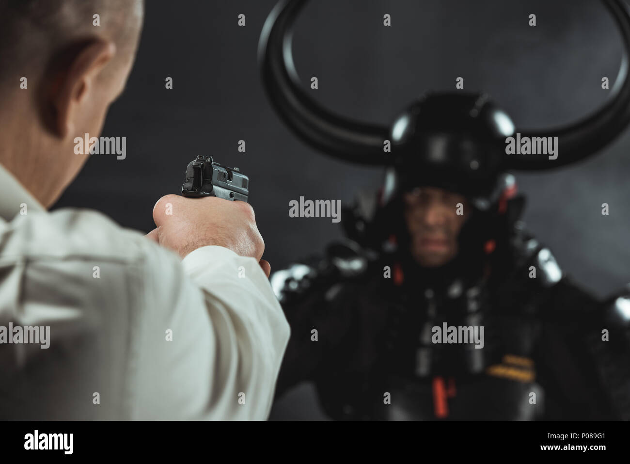 Man aiming handgun rear view hi-res stock photography and images - Alamy