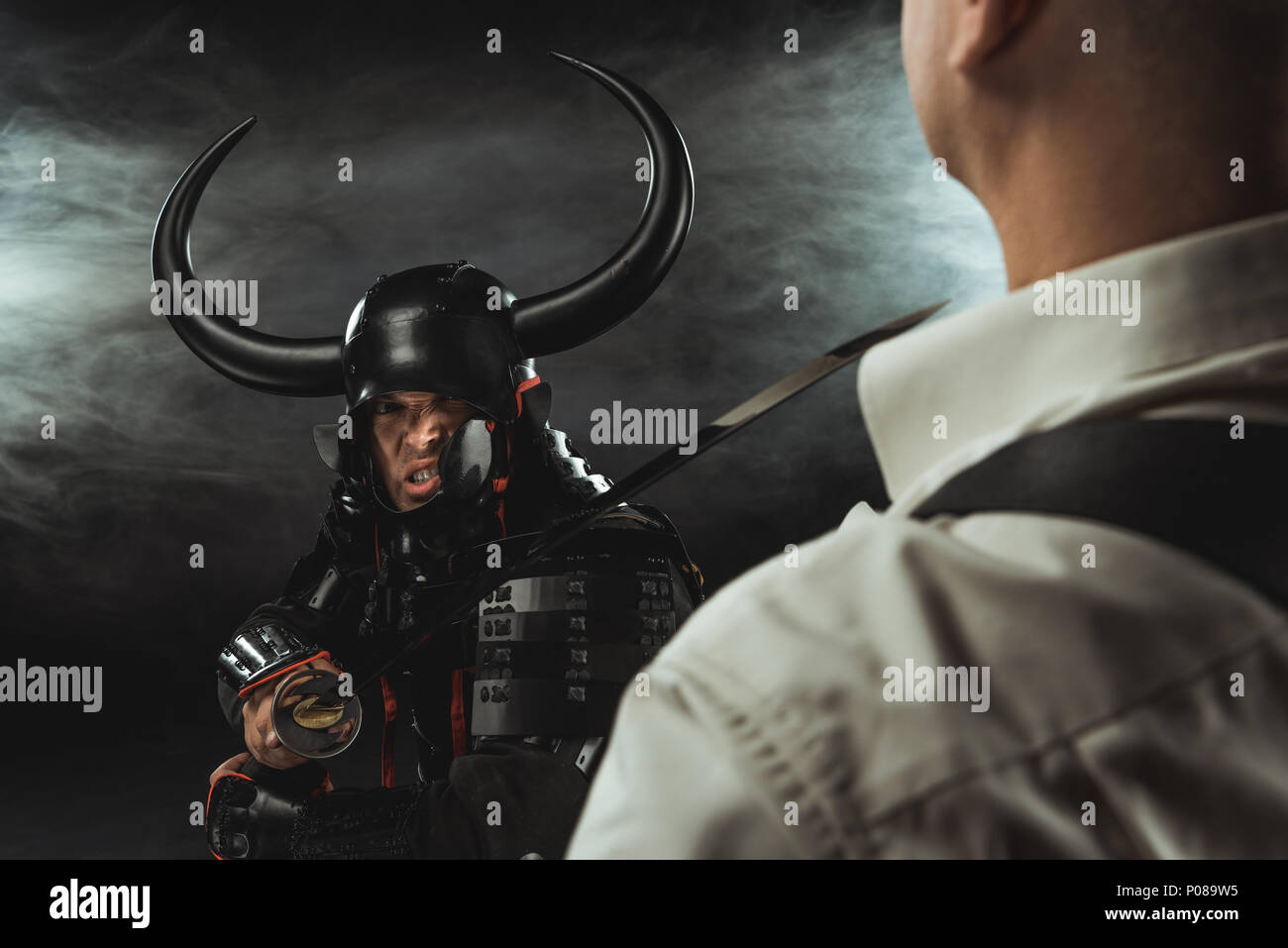 angry samurai with katana ready to kill modern man Stock Photo - Alamy