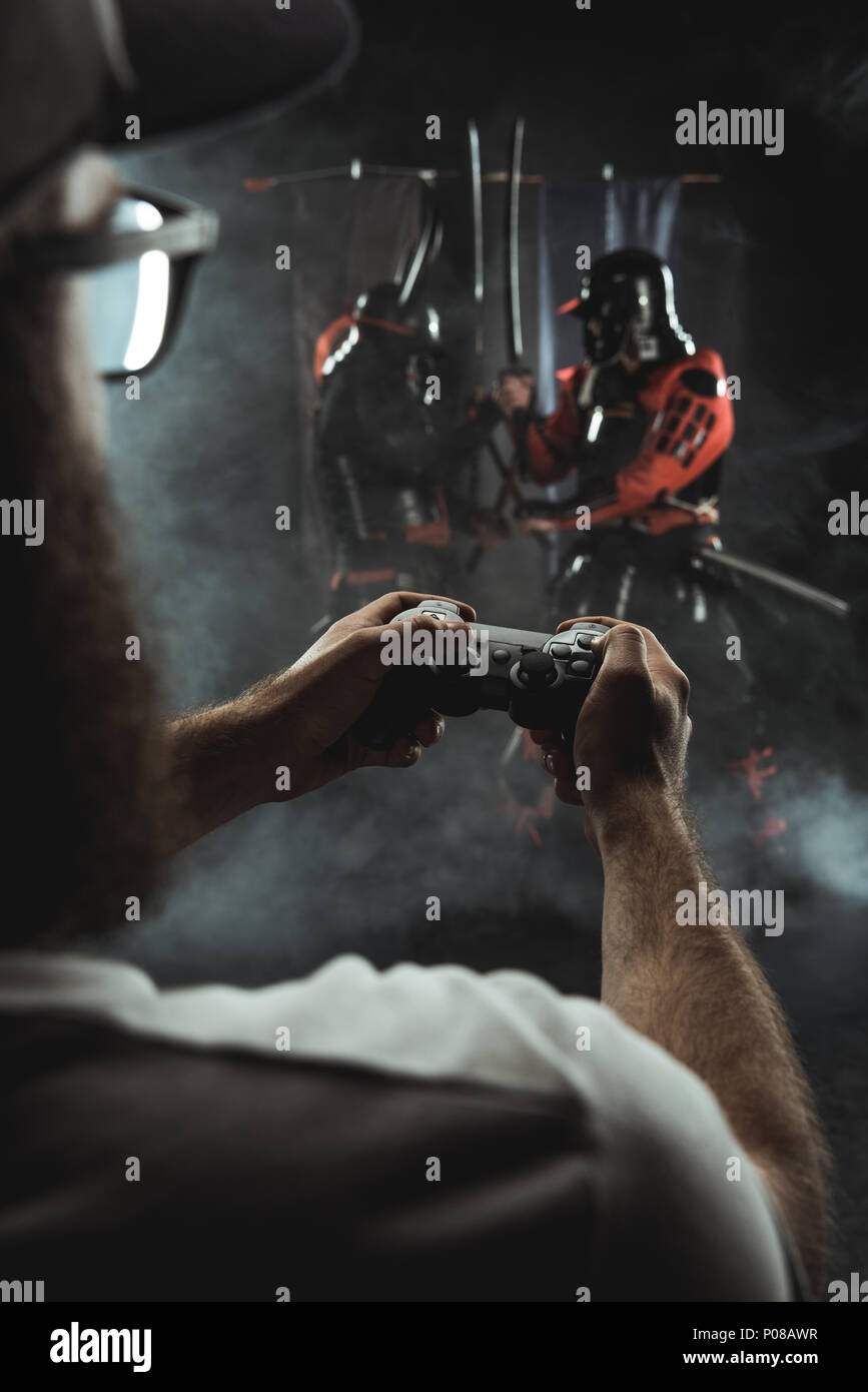 mature man playing samurai fighting with gamepad in real life Stock ...