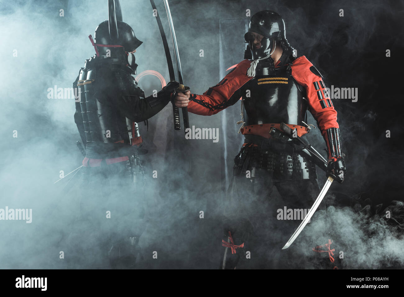 armored samurai greeting each other on black Stock Photo - Alamy