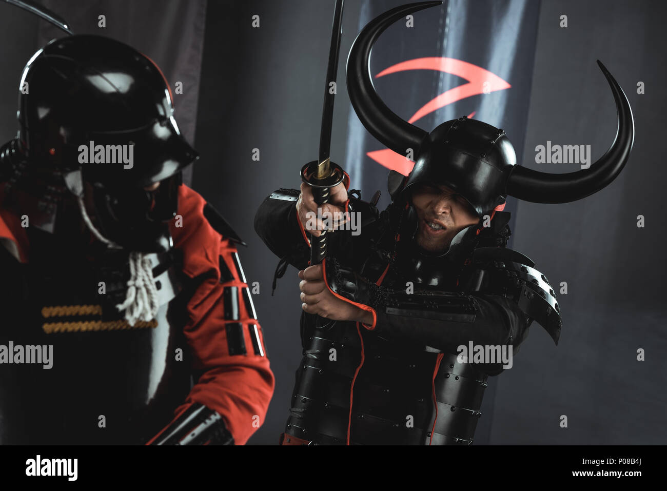 samurai in traditional armor fighting with katana swords Stock Photo ...