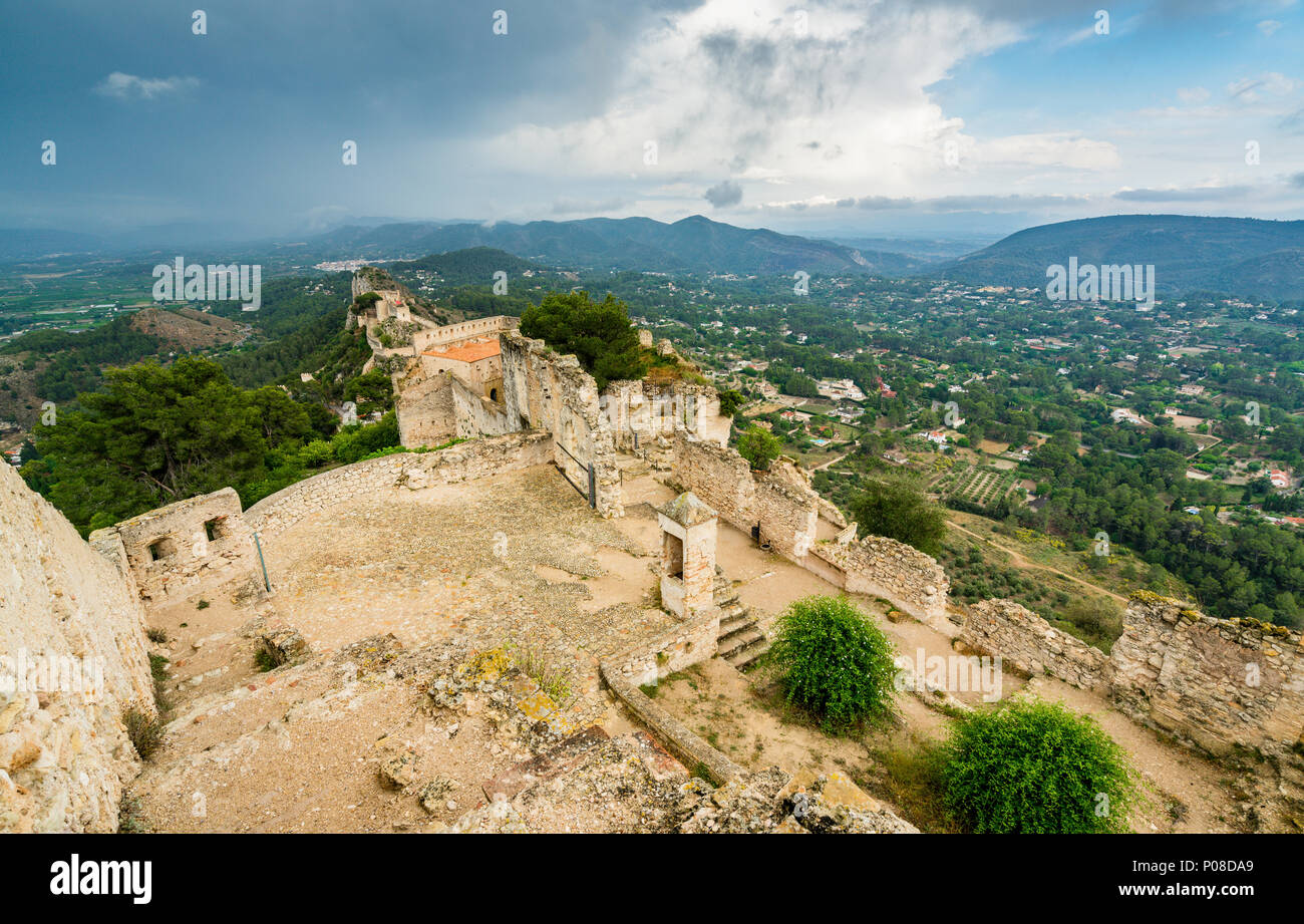 The medieval castle of Xativa against a dramatic and bright sky after ...