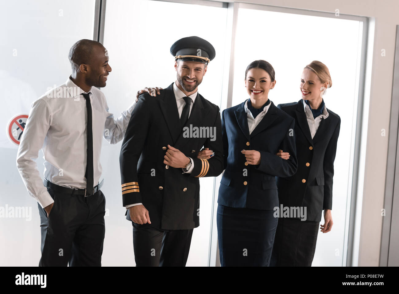 happy aviation personnel team in professional uniform Stock Photo - Alamy