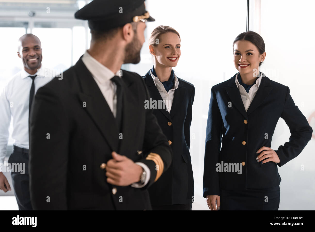 pilot and his team spending time in airport before flight Stock Photo ...