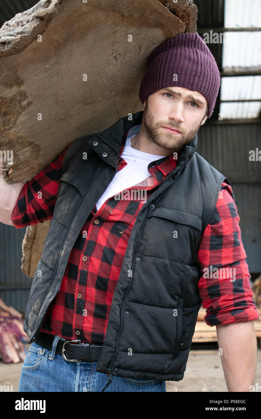 Man carrying log on shoulders hi-res stock photography and images - Alamy