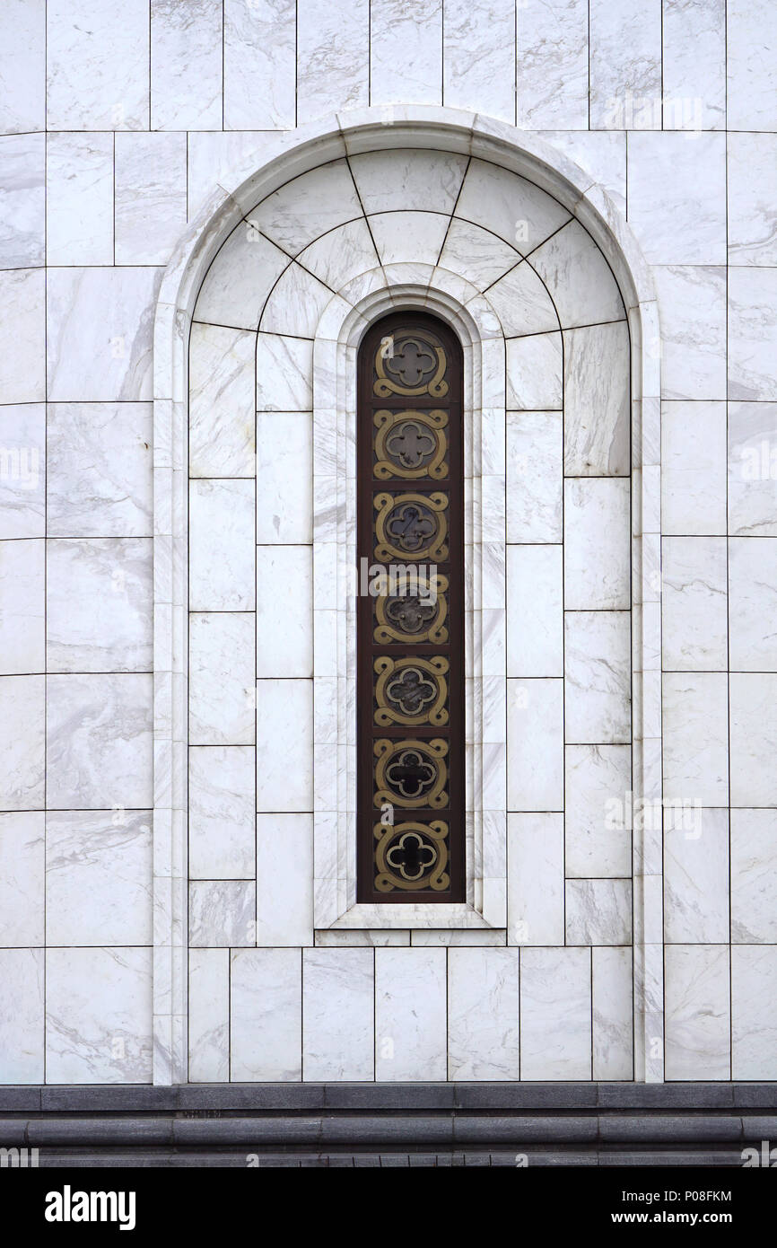 Window at white marble wall of church Stock Photo - Alamy