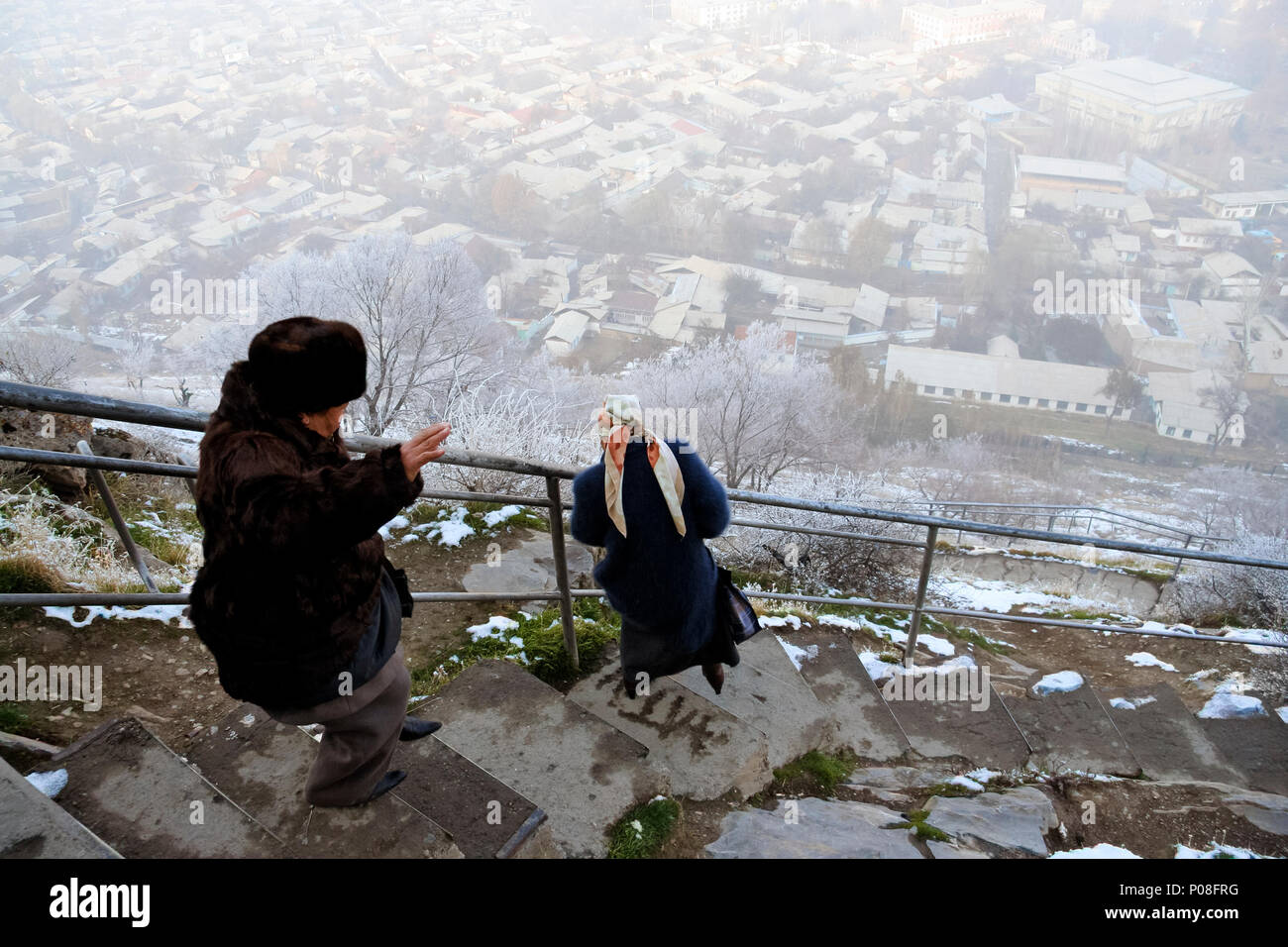 Osh, Kyrgyzstan : Panoramic view of Osh. Kyrgyz women desdending from ...