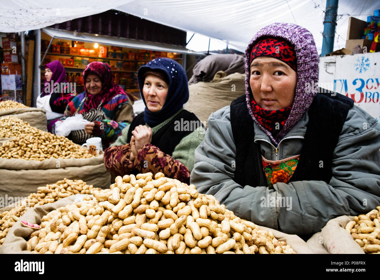Women selling peanuts. Osh Bazaar, Kyrgyzstan Stock Photo - Alamy