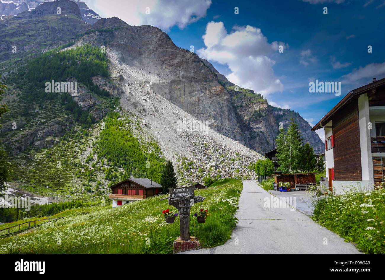 Wooden barns and meadows at the Scene of the 1991 rockfall, landslide ...