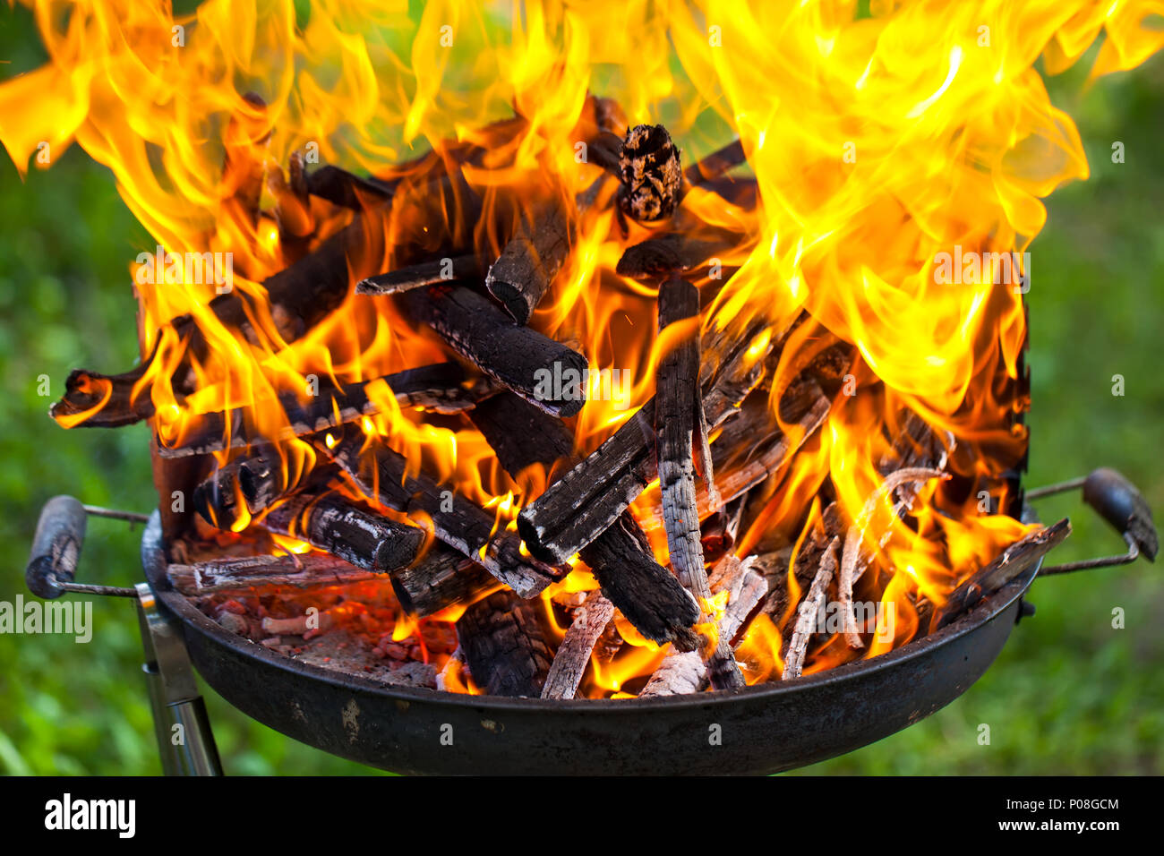 Close up picture of fire on a barbeque - preparation for cookout ...