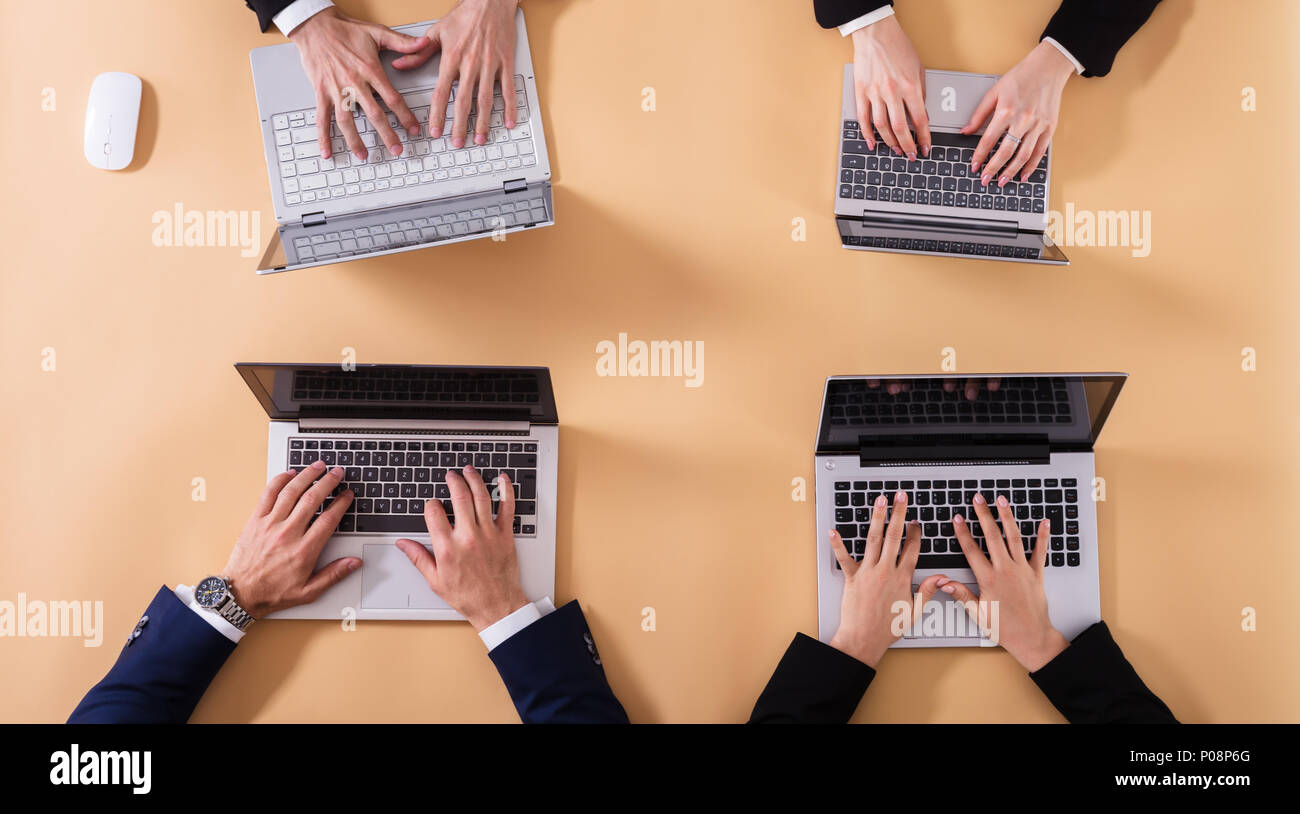 Group working on laptops hi-res stock photography and images - Alamy