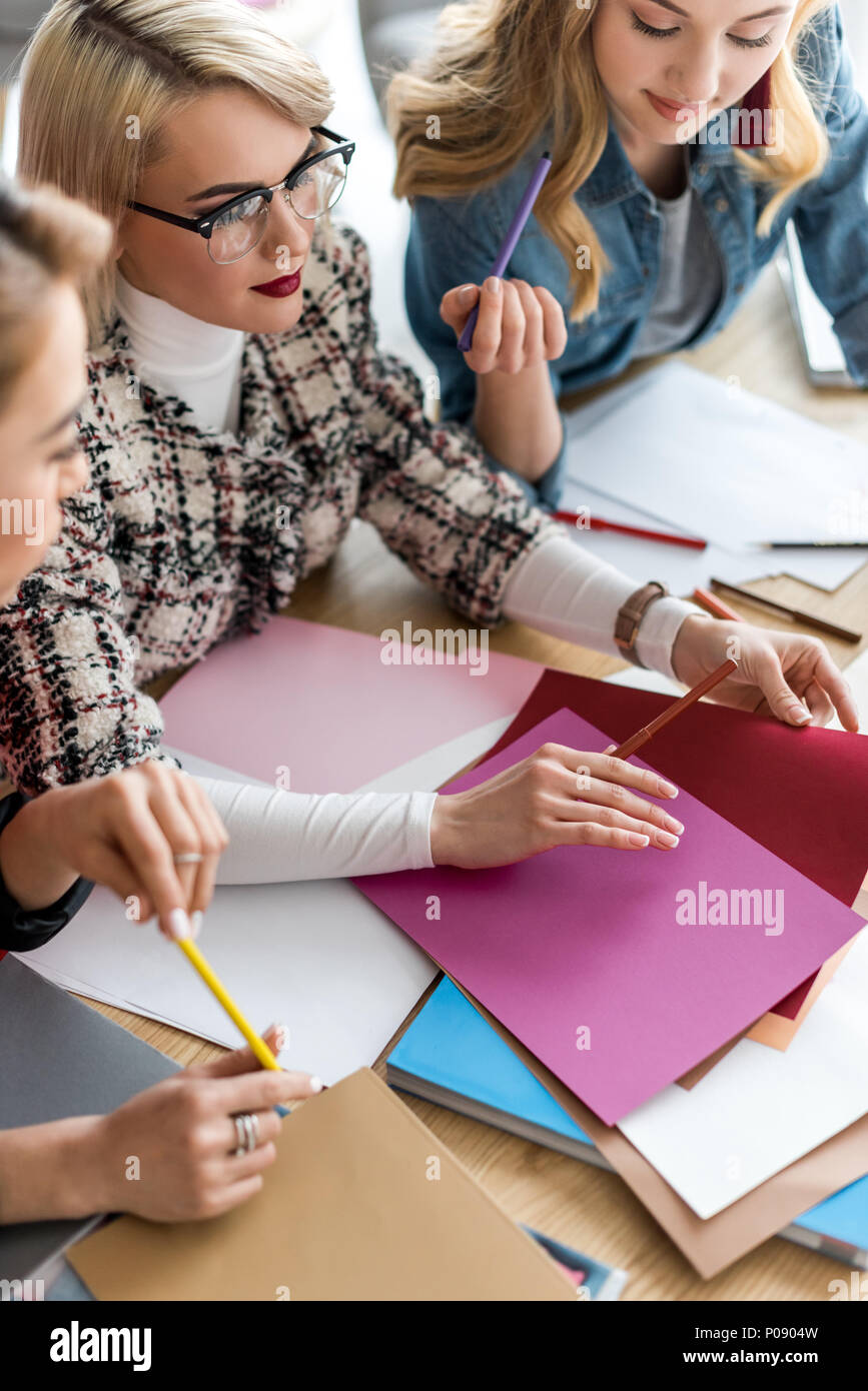 magazine editors working with color palette at workplace Stock Photo ...