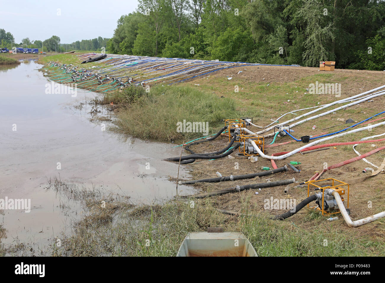 Pumping Out Flood Water at Levee Embankment Stock Photo - Alamy
