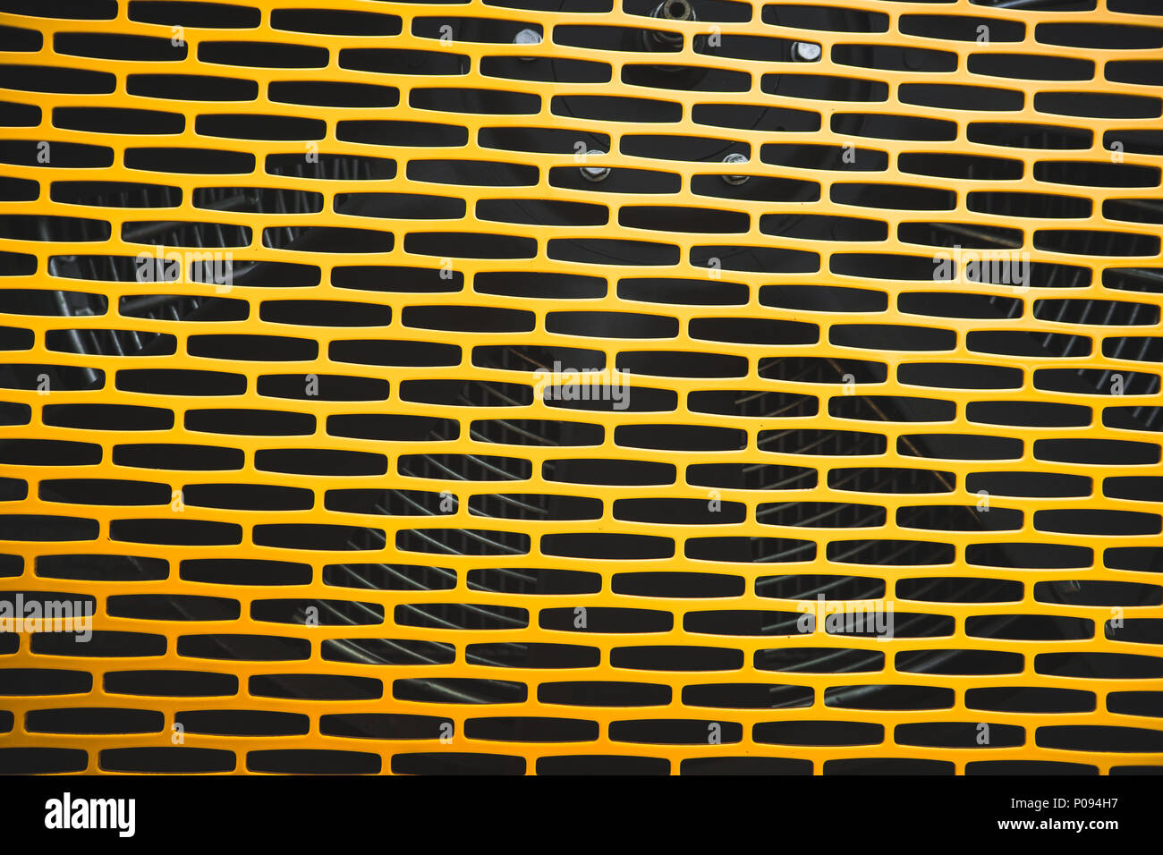 yellow front Grille of the new farm tractor Stock Photo - Alamy