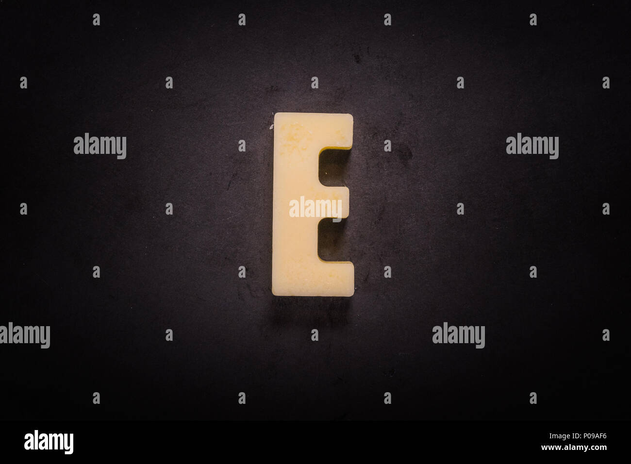 Butter Letter E on cast iron skillet background Stock Photo - Alamy