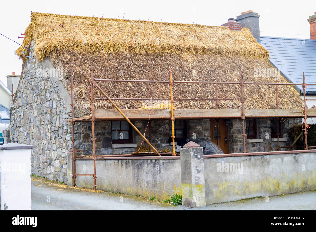 New Thatched roof house, thatch roof being re-thatched, new build ...