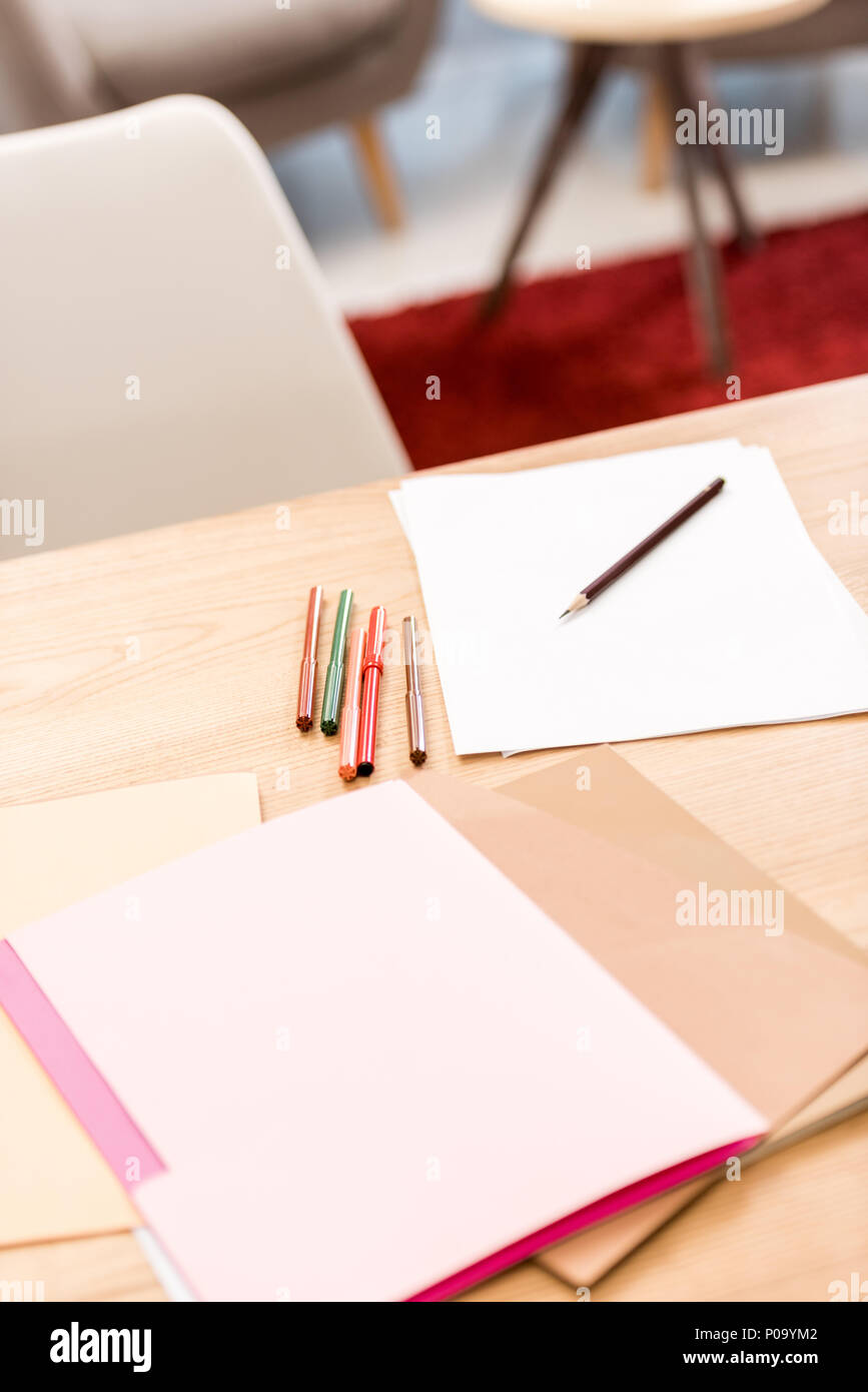 documents and folders with markers on table in office Stock Photo - Alamy
