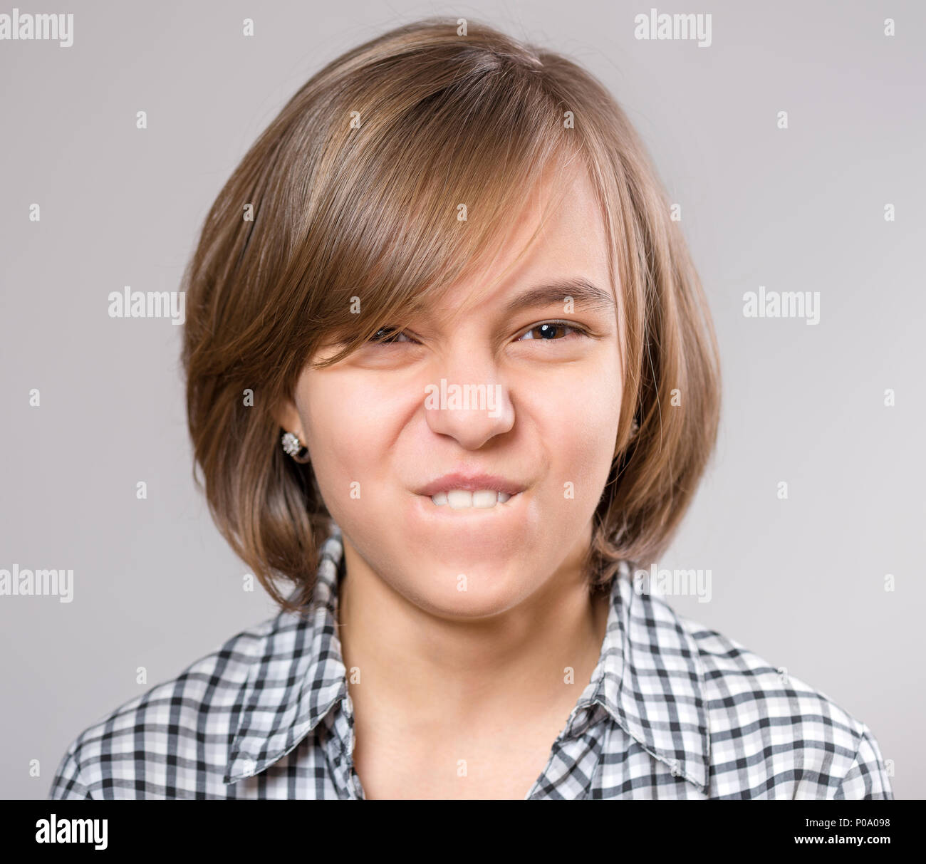 Kid grimacing hi-res stock photography and images - Alamy