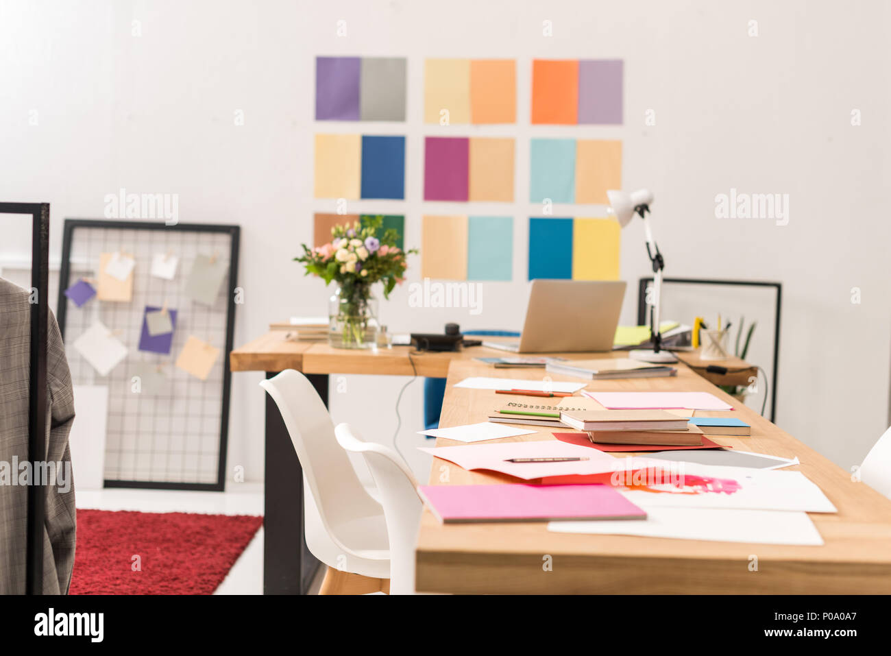documents at workplace in fashionable modern office with color palette ...