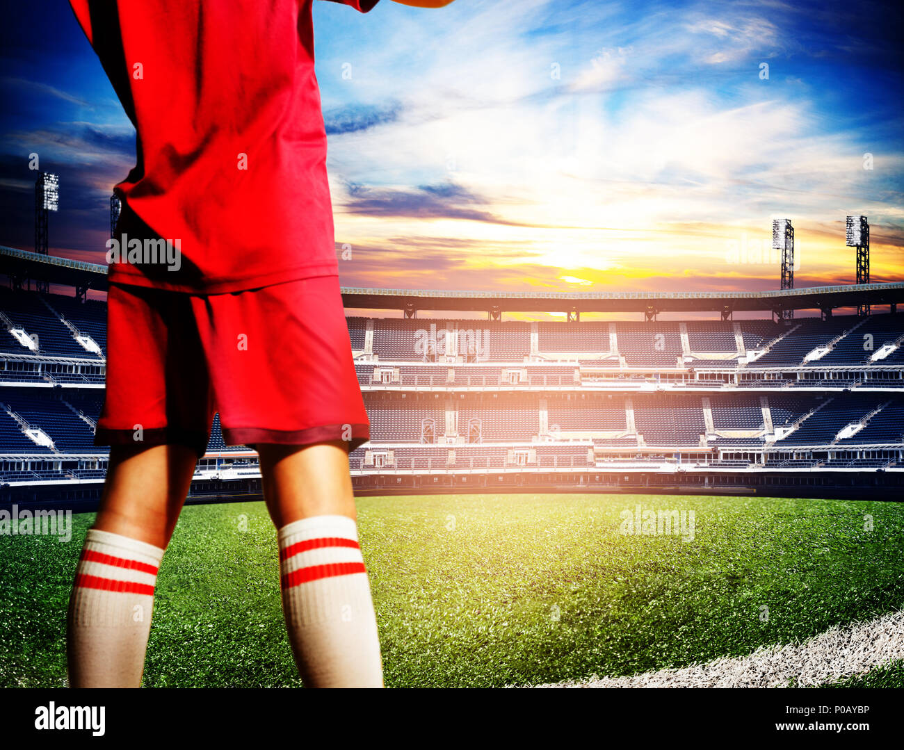 Body of the the little soccer player over big football stadium as world ...