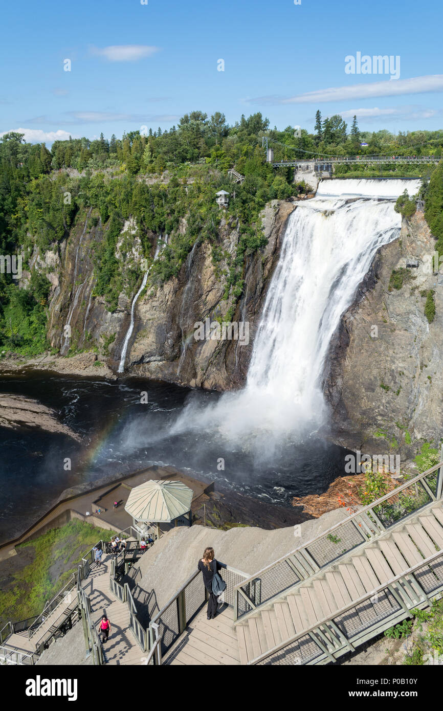 People standing on the cliffside stairs viewing the magnificent ...