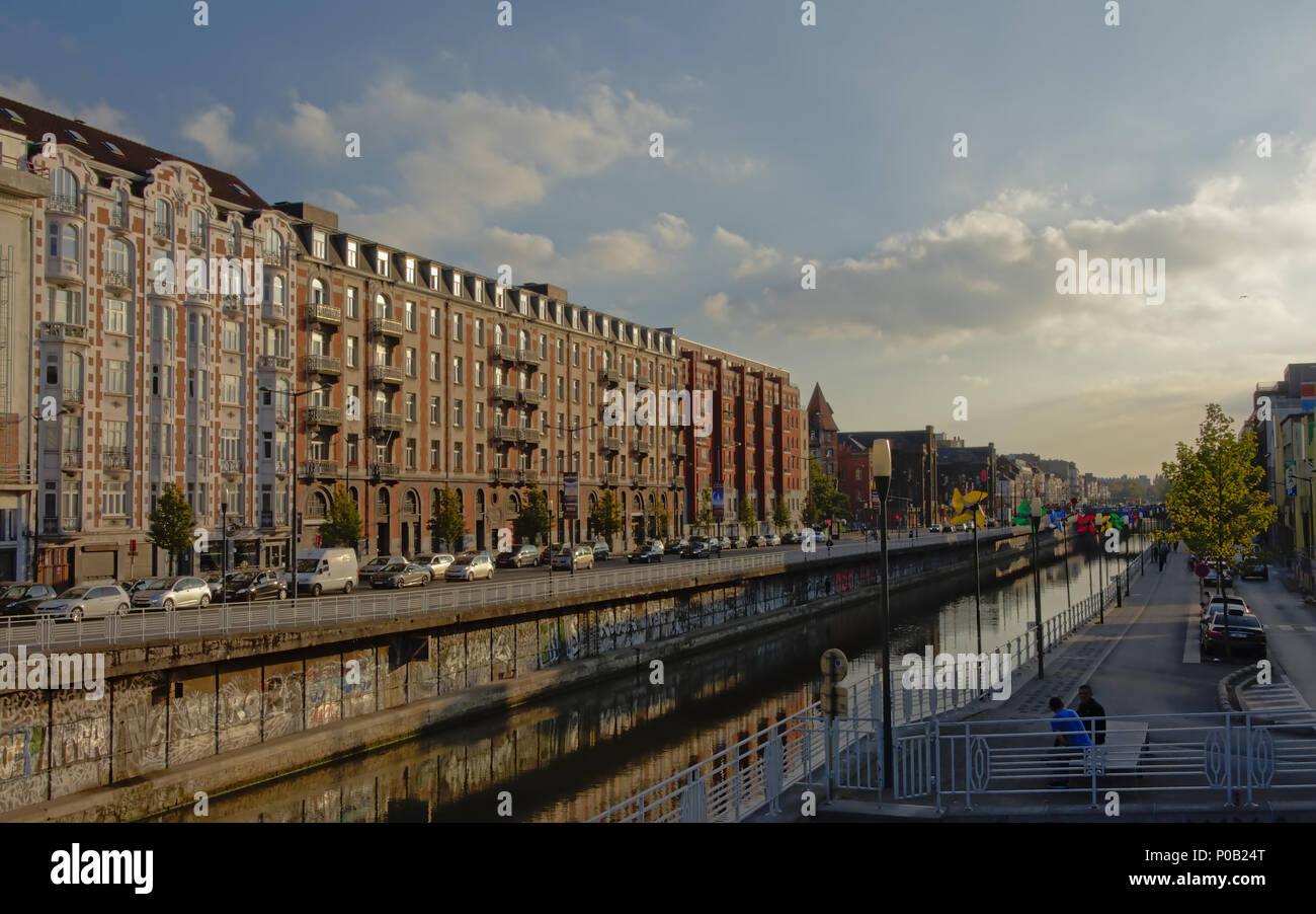 Canalized river Senne in Brussels with quays with typical brick ...