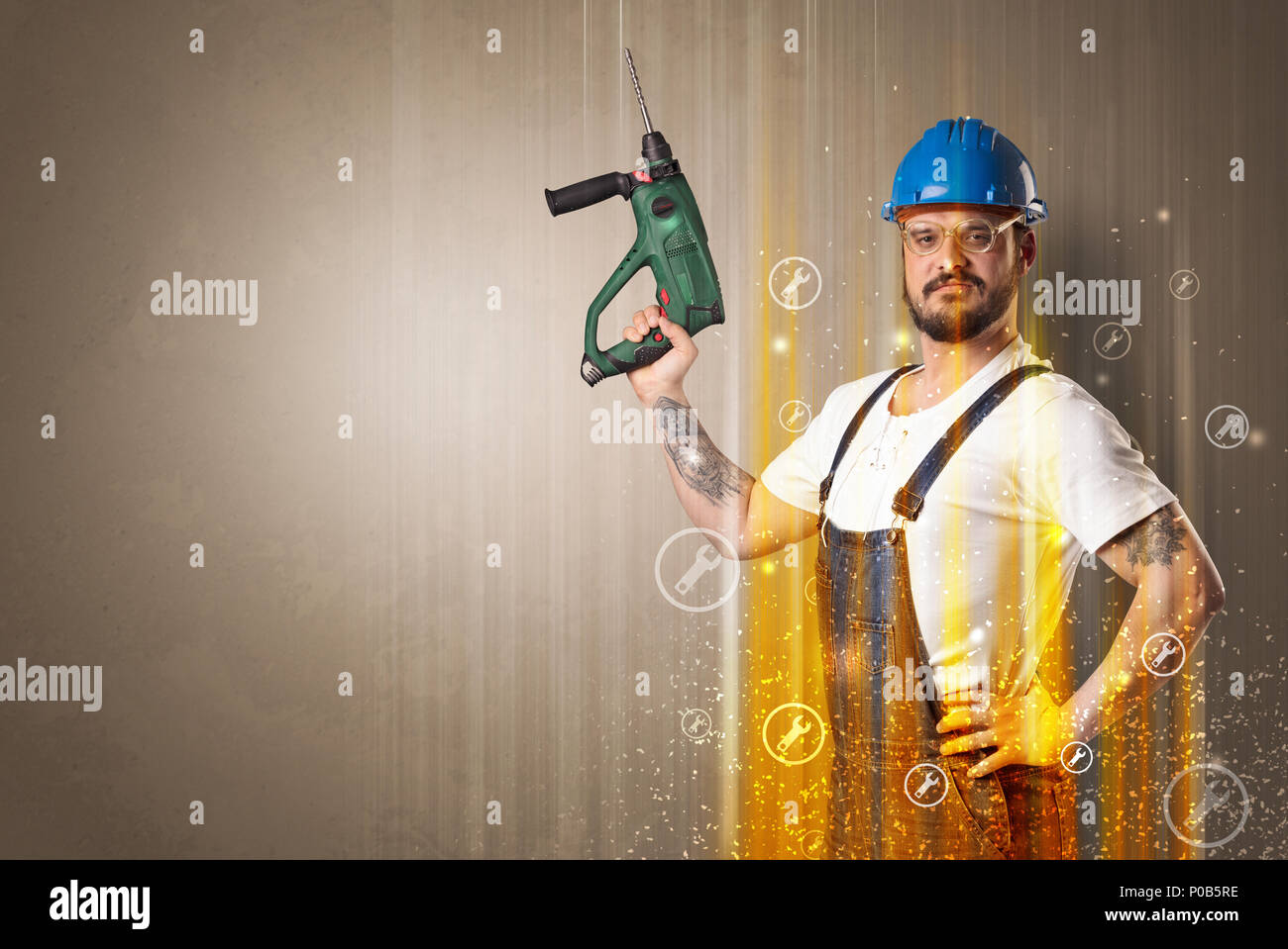 Manual worker with wrench symbols and tool Stock Photo - Alamy